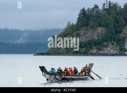 Visitors paddle Loo Plex, replica of the Bill Reid cedar canoe, Lootaas ...