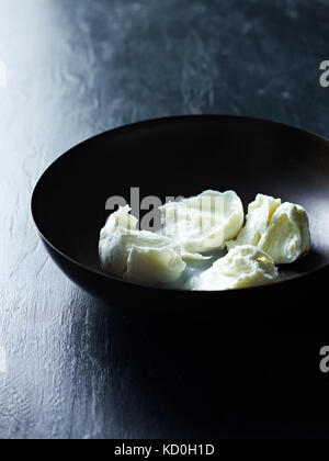 Torn Buffalo white mozzarella cheese isolated on white background. top ...