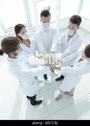 Health care workers demonstrating unity, bottom view Stock Photo - Alamy