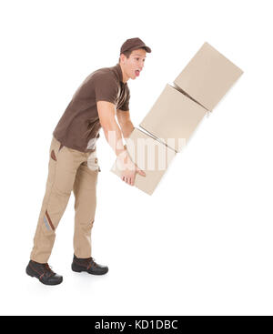 Young handsome man with fragile box ordered from Internet Stock Photo ...