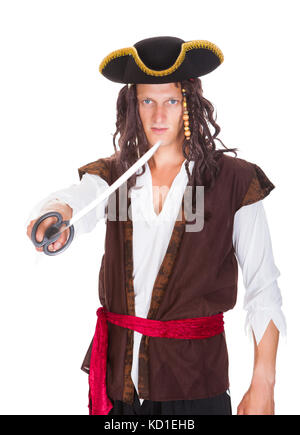Young pirate holding sword isolated on white Stock Photo - Alamy