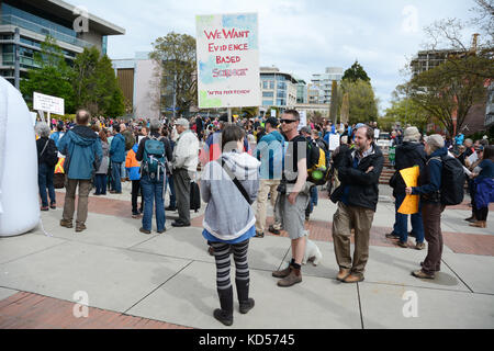 Environmental activists and demonstrators gather at an outdoor peaceful ...