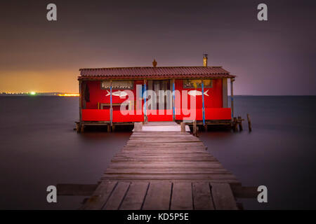 A fisherman's red cabin in axios river delta, Thessaloniki, Greece ...