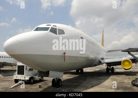 Unmarked airliner jet plane parked at its gate at Heathrow Airport ...