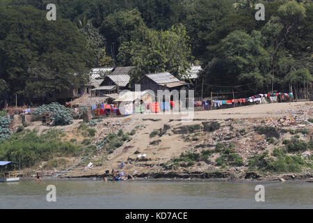 Asia, Burma-Myanmar, Clothes hung to dry on the edge of town and river ...