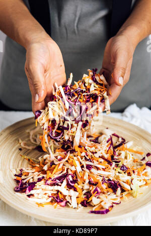 Shredded red cabbage in bowl on green background. Vegetarian healthy ...