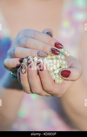 Female demonstrating pearl necklace Stock Photo - Alamy