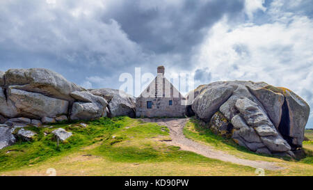 House between the rocks in Meneham village, Kerlouan, Finistere ...