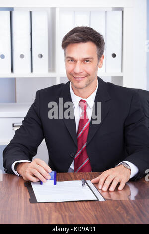 man in a suit an official is working at the computer Chief Stock Photo ...