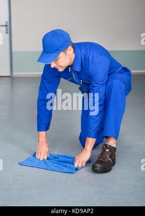 Glad mature worker man standing in winery production section Stock ...