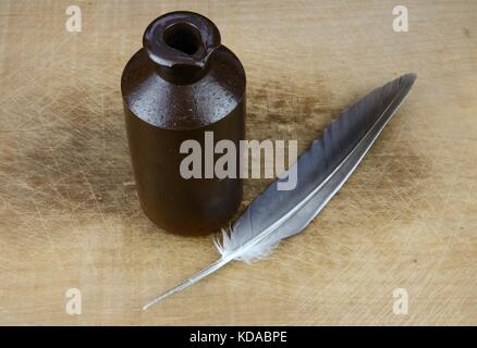 Vintage Stoneware Ink Bottle with Feather Quill Stock Photo - Alamy