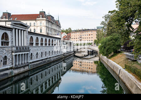 River Ljubljanica bank Triple Bridge in old city center in Ljubljana ...