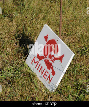German land mines warning sign from World War Two, wet with water ...
