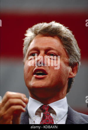 Former President Bill Clinton, behind, and former Secretary of State ...