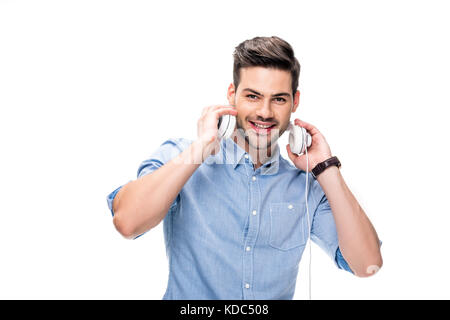 Male taking off headphones Stock Photo - Alamy