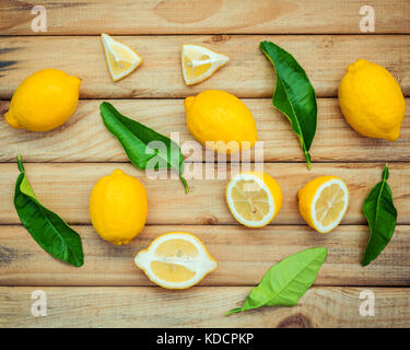Sliced fresh lemons and lime. Wooden table Stock Photo - Alamy