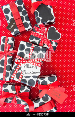 Little presents with red ribbons on red polka dot background Stock ...