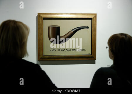 (171012) -- BRUSSELS, Oct. 12, 2017 -- A woman walks past Rene Magritte ...