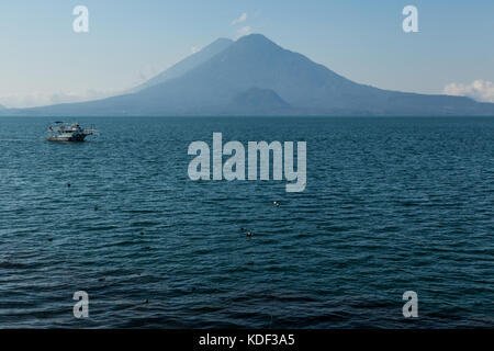 chicken bus at lake atitlan in guatemala Stock Photo - Alamy