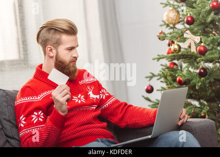 New Year, online shopping and christmas concept. Happy bearded man ...