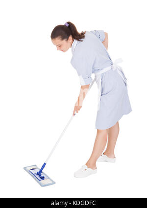 Young beautiful maid dusting on white background in cleaning uniform Stock Photo: 151745436 - Alamy