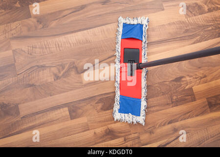 High angle view of brush with wipe pads on wooden table Stock Photo - Alamy