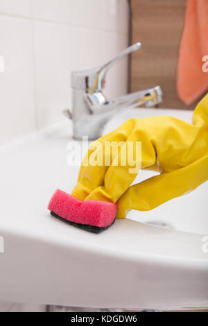 close up maid hand in the hotel ironing clothes in hotel room on white ...