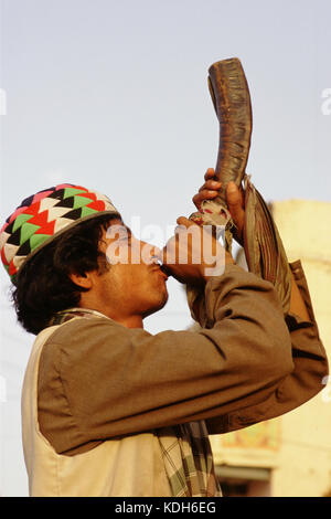 Profile of a boy blowing a trumpet Stock Photo - Alamy