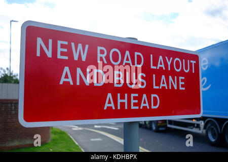 A "New Road Layout Ahead" sign on a main road near a busy junction on ...