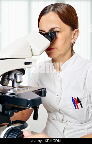 Pathologist with microscope Stock Photo - Alamy