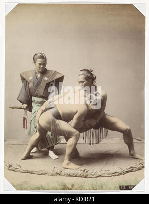 This photograph captures sumo wrestlers in Japan, representing the ...