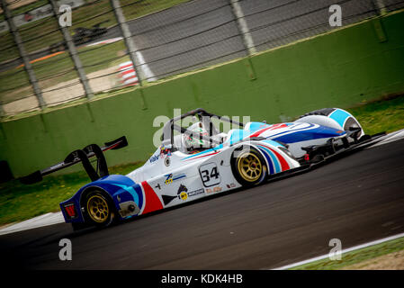 Prototype car in action at turn during the race Stock Photo - Alamy