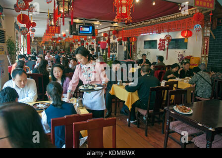 Chinese waitress serving in restaurant Stock Photo: 97399870 - Alamy