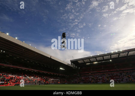 Overhead photo of a football or soccer player sliding in to save the ...