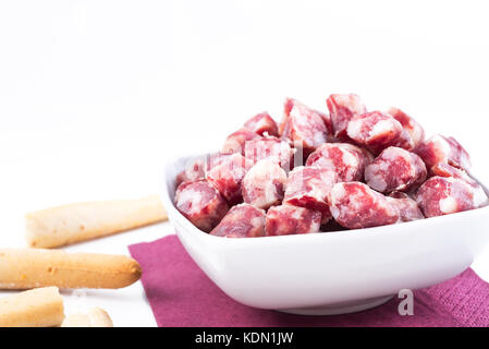 Smoked dry italian salami sliced on a wooden board Stock Photo - Alamy
