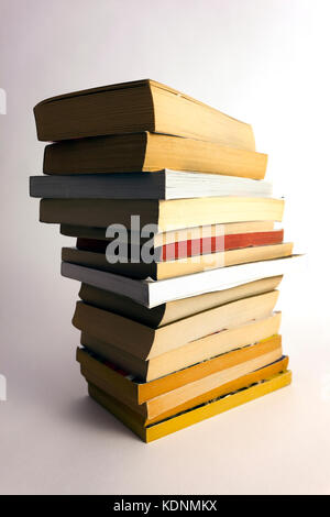 Books irregularly stacked Stock Photo - Alamy