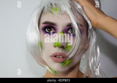 Halloween white and green witch makeup Stock Photo - Alamy