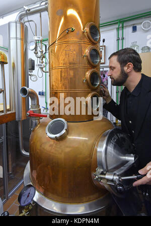 Zeitz, Germany. 10th Oct, 2017. Daniel Rost, master distiller, tasting ...