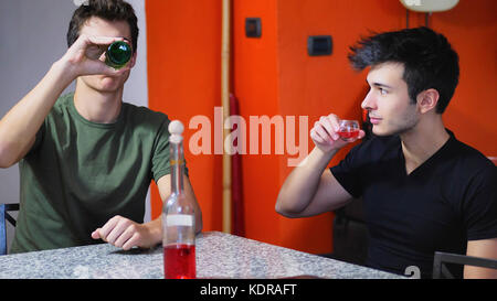 Content young men partying at table Stock Photo - Alamy