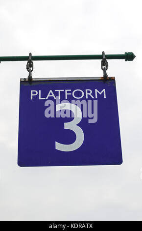 Train leaving station platform number one Stock Photo - Alamy