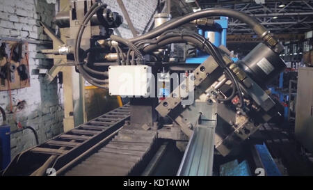 Manual worker cutting aluminium profiles. Manufacturing jobs ...