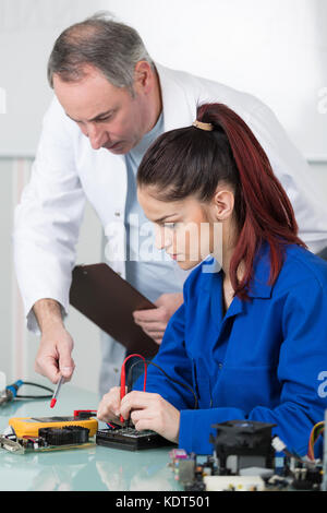 female electronic assembler Stock Photo - Alamy