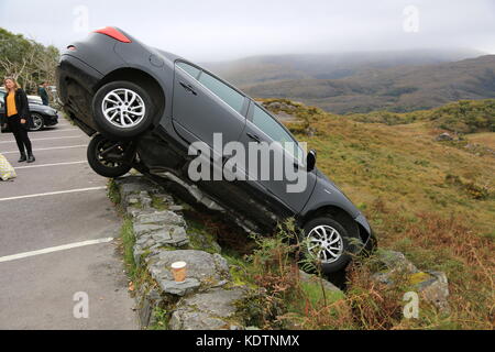 Car falling off the side of a mountain road in Ireland Stock Photo - Alamy
