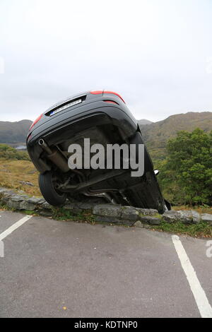 Car falling off the side of a mountain road in Ireland Stock Photo - Alamy