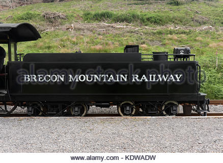 Coal tender of a railway steam locomotive SE & CR set against a blue ...