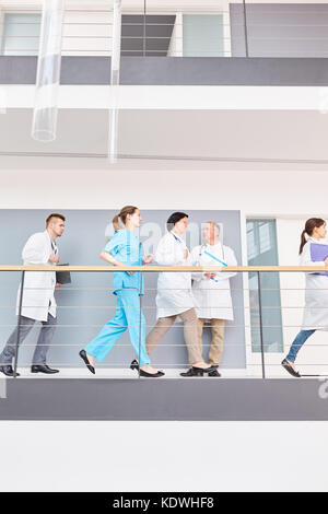 Emergency service team run fast as team of doctors Stock Photo - Alamy