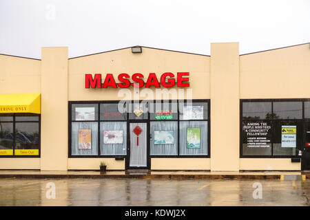 The exterior storefront of a massage parlor in a strip mall in Oklahoma ...