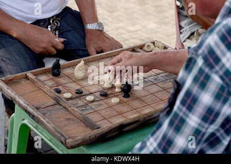 Thailand chess. Makruk. Men playing version of Thai chess board game ...