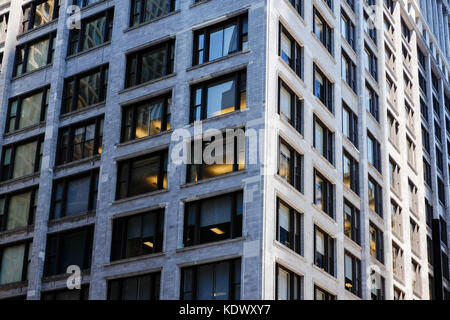 Looking up the corner of a skyscraper building on an overcast day Stock ...
