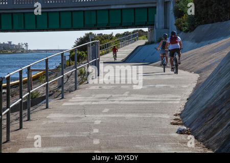 Bicycle path along Ballona Creek with the snow covered San Gabriel ...